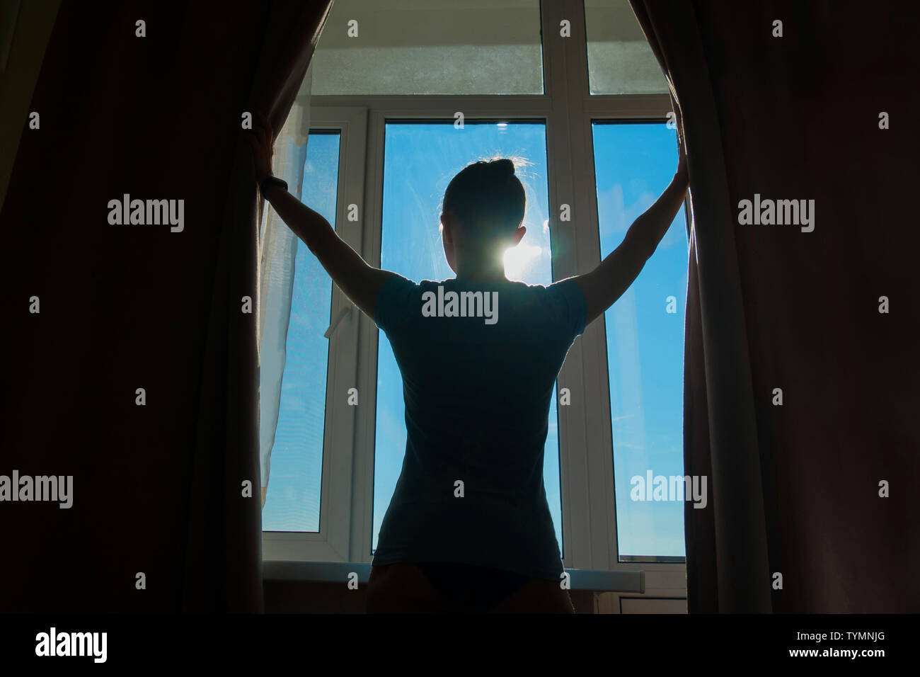 Woman opening modern window home hi-res stock photography and images ...