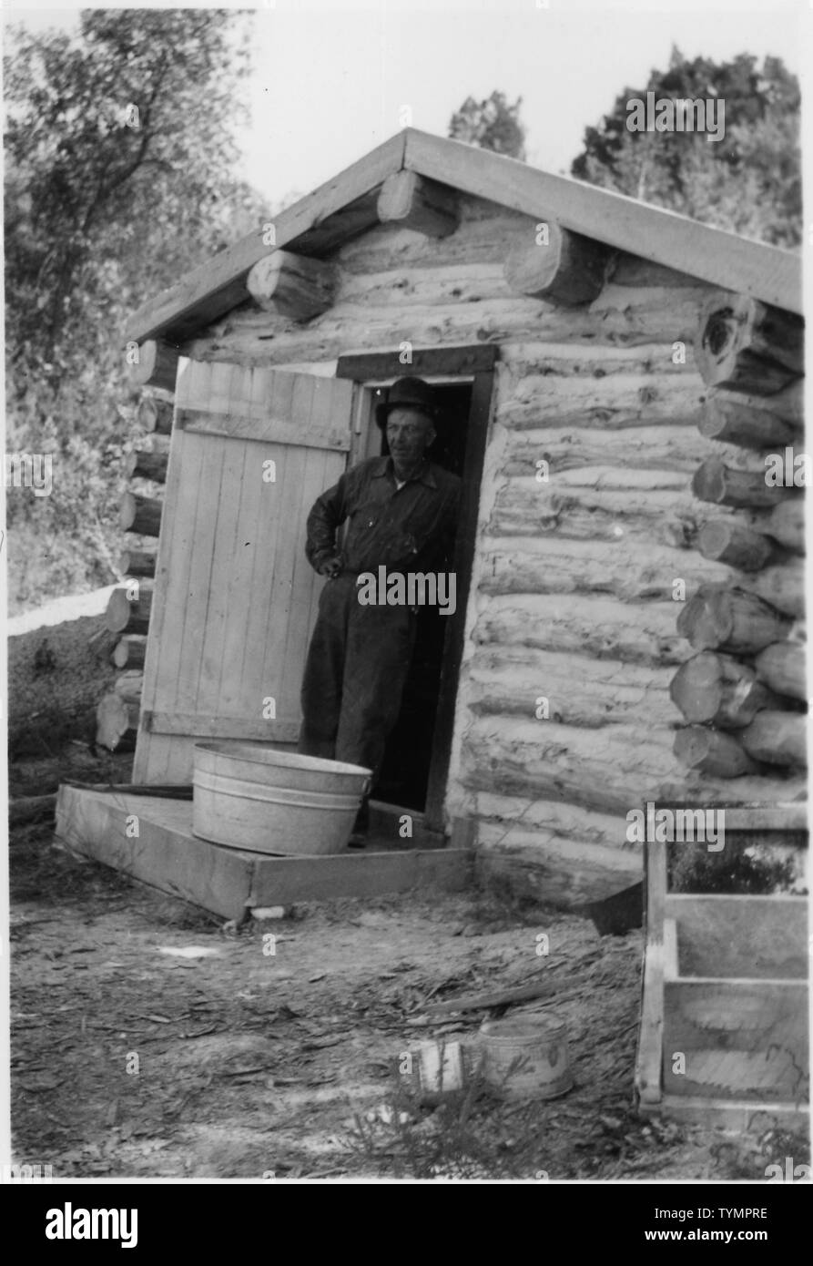 Tom O'Rourke in doorway to his storage cellar and milk house Stock ...