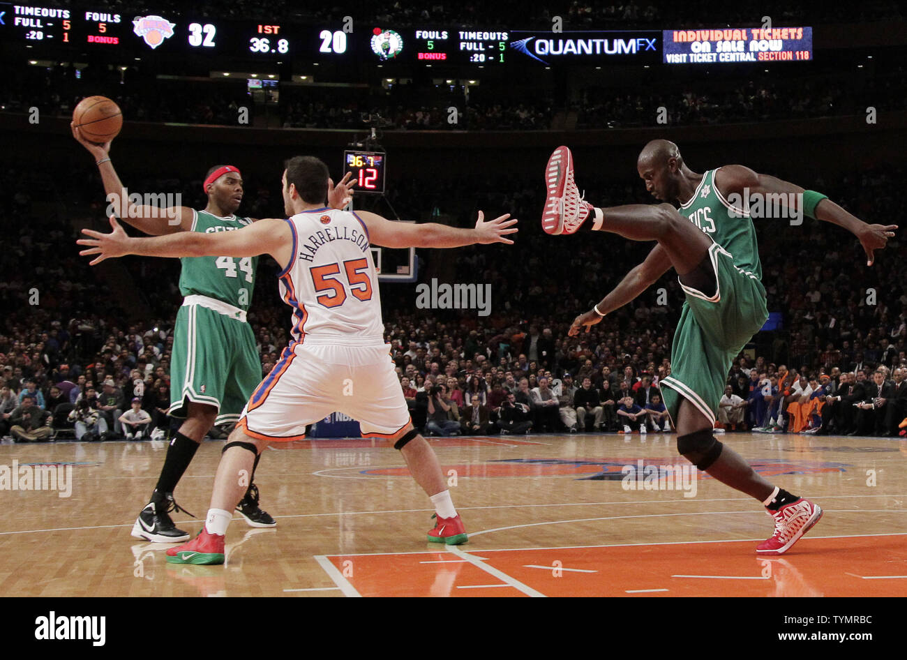 New York Knicks Josh Harrellson plays defense as Boston Celtics Kevin ...