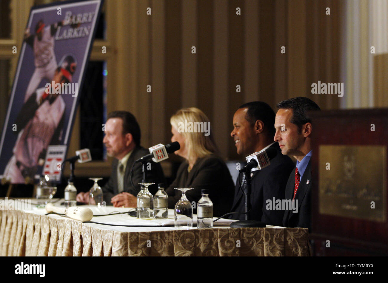 Cincinnati Reds shortstop Barry Larkin sits between Jane Forbes Clark ...