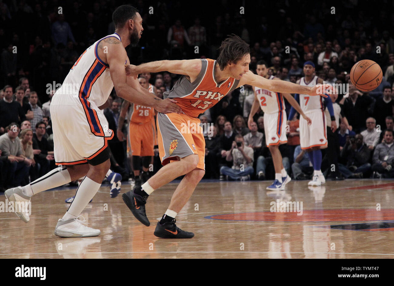 New York Knicks Jared Jeffries fouls Phoenix Suns Steve Nash and sends ...