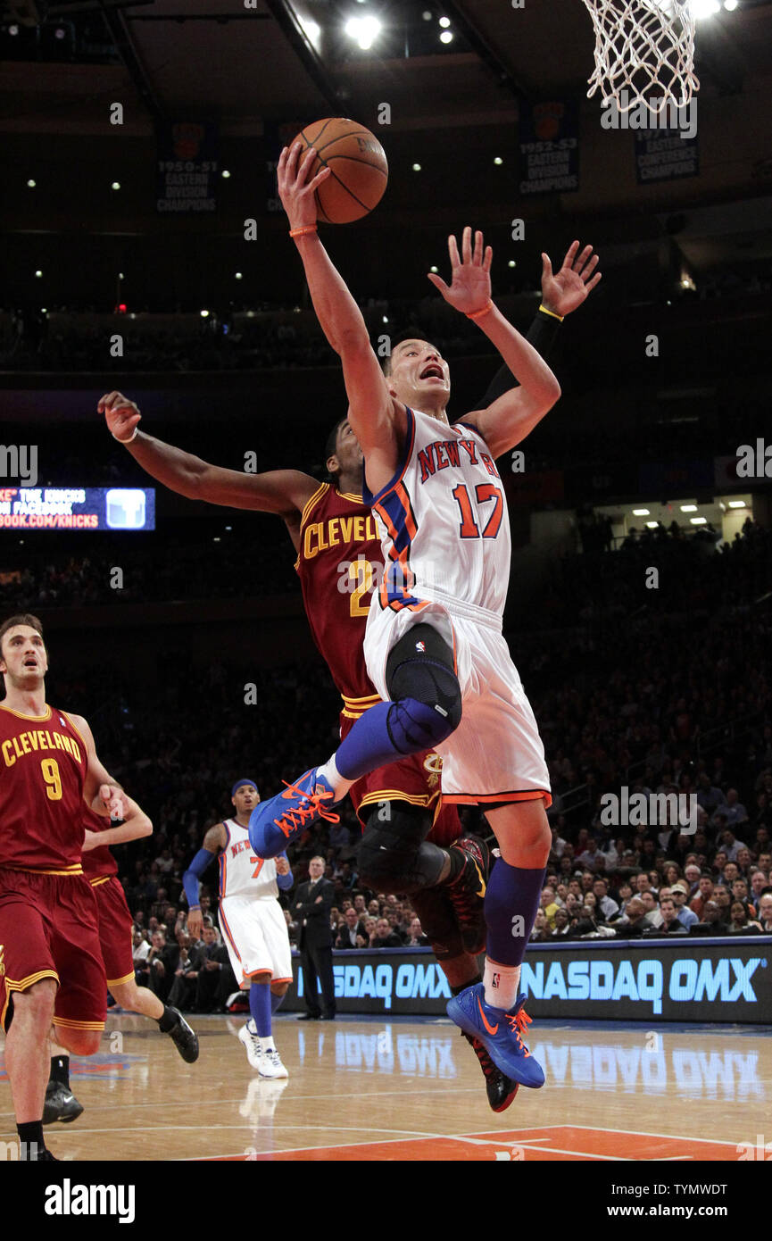 New York Knicks Jeremy Lin drives by Cleveland Cavaliers Kyrie Irving ...