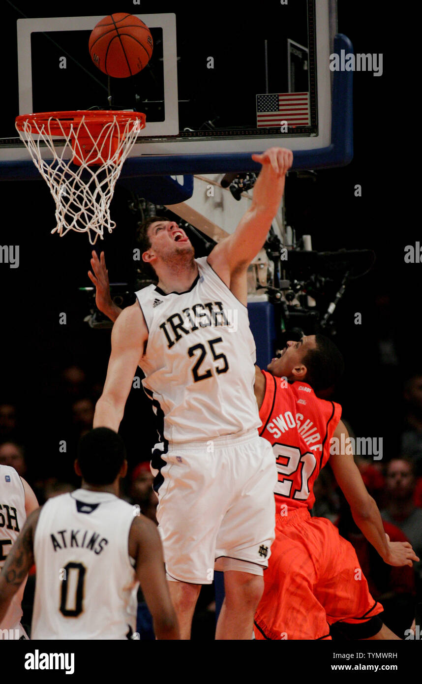 Tom Knight (25) of Notre Dame blocks the throw by Jared Swopshire of ...