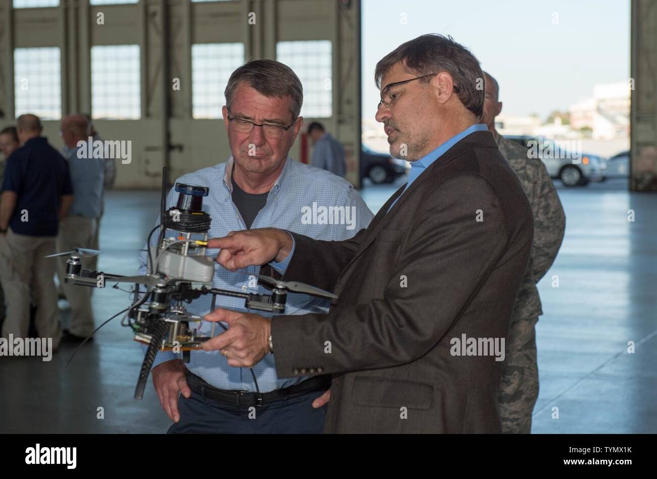 Secretary of Defense Ash Carter observes static displays of advanced weapons systems and ...