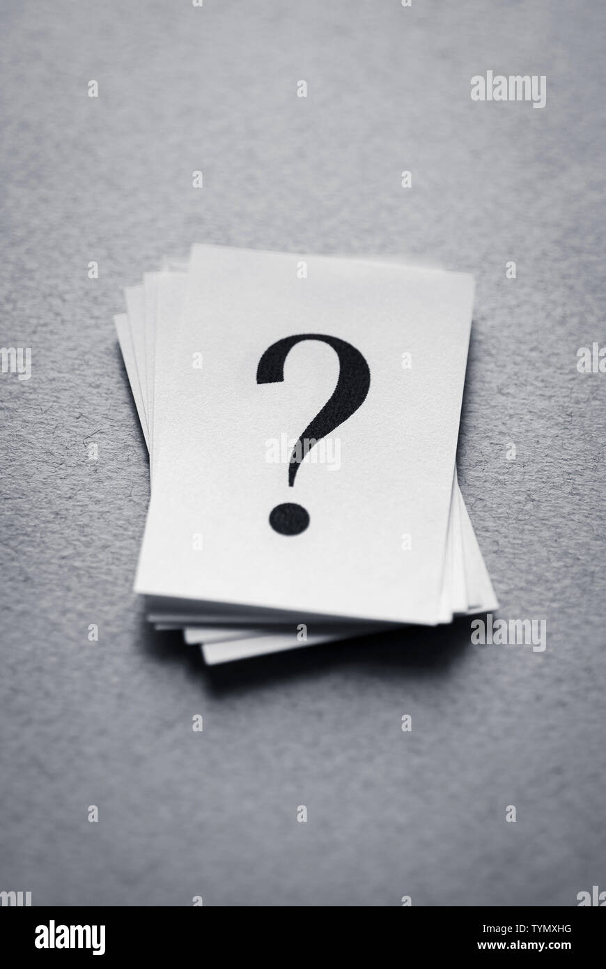 Paper card with a question mark on a gray background, concept Stock ...