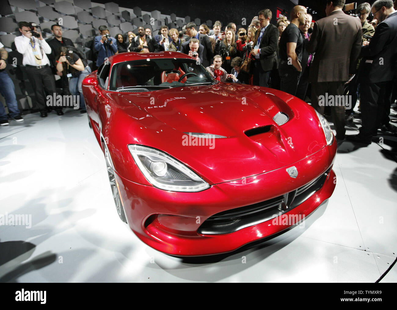 Members of the media check out the Nissan's 2013 SRT Viper after it was ...