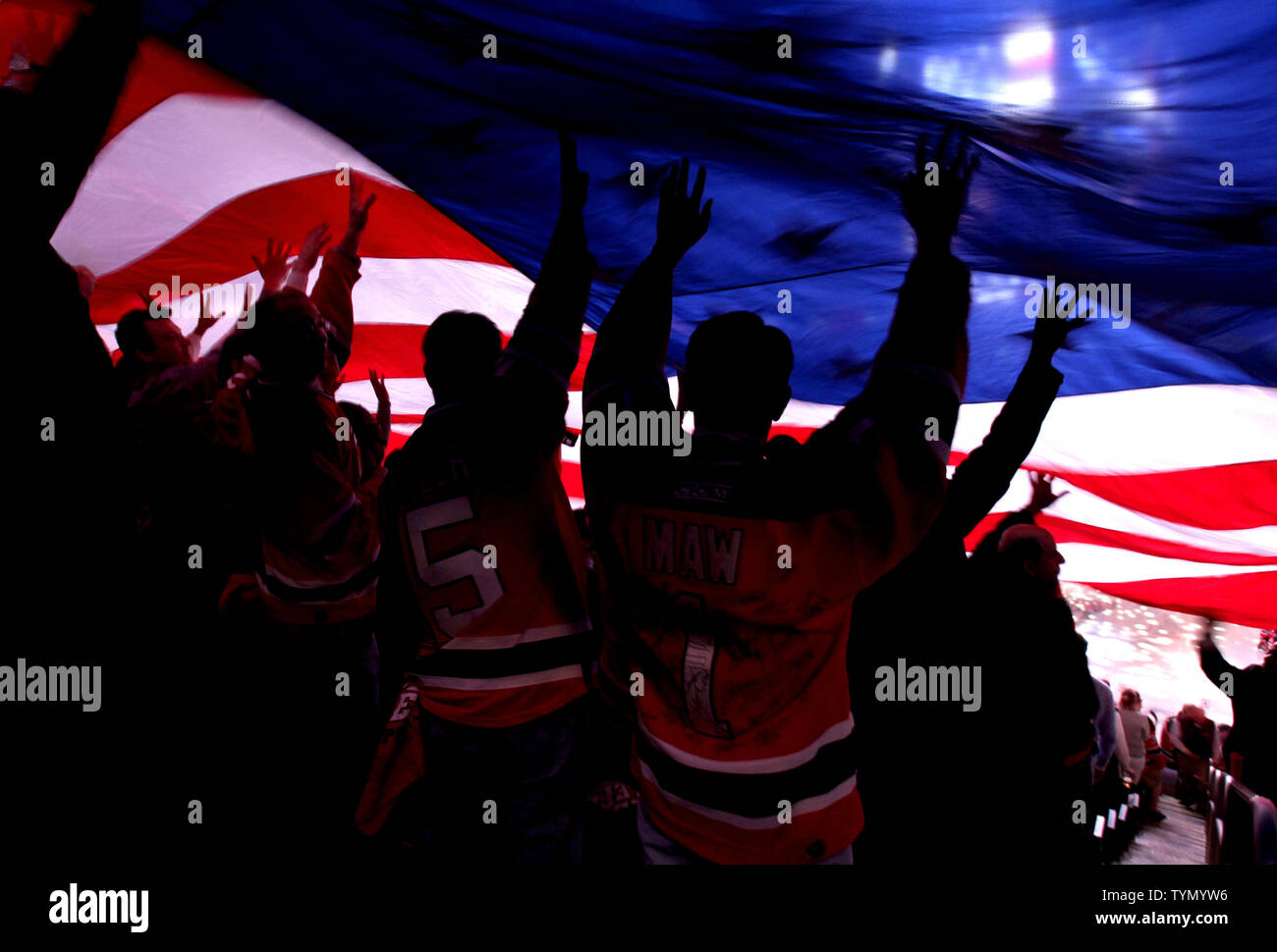 Devils Fans pass around a giant American Flag during the National ...