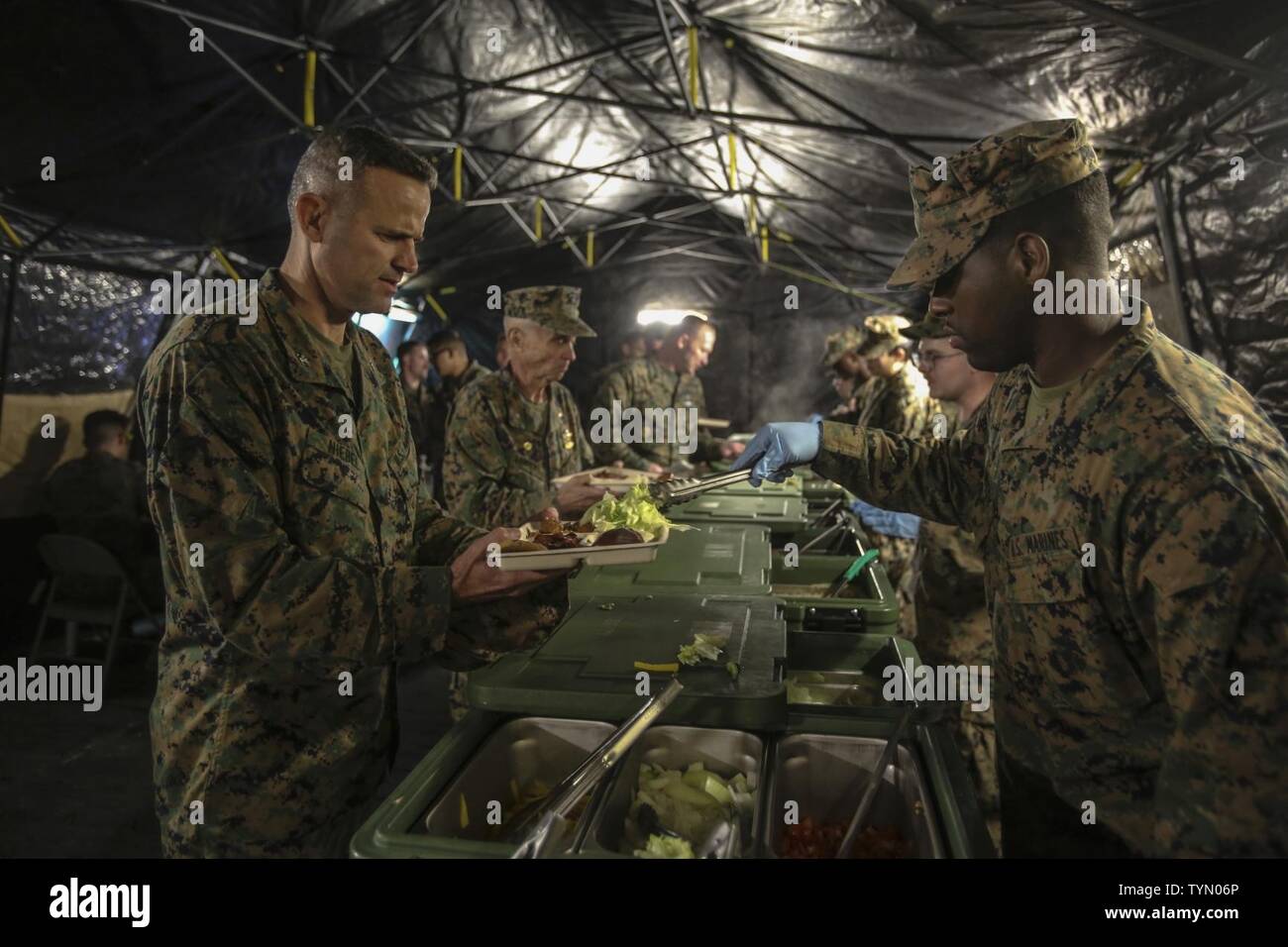 Corporal Logan Twitty serves Col. Andrew Niebel after the 2nd Marine ...