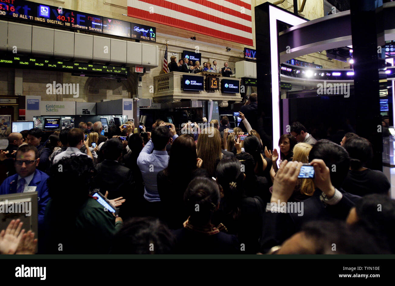 A new NYSE logo is on a flat screen monitor for the closing bell at the ...
