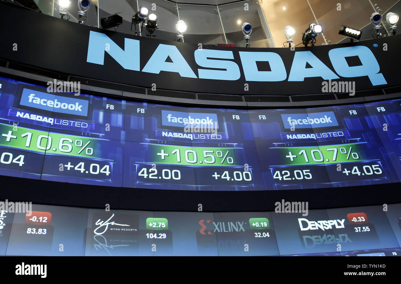 The board shows a small gain as Facebook begins trading at the Nasdaq ...