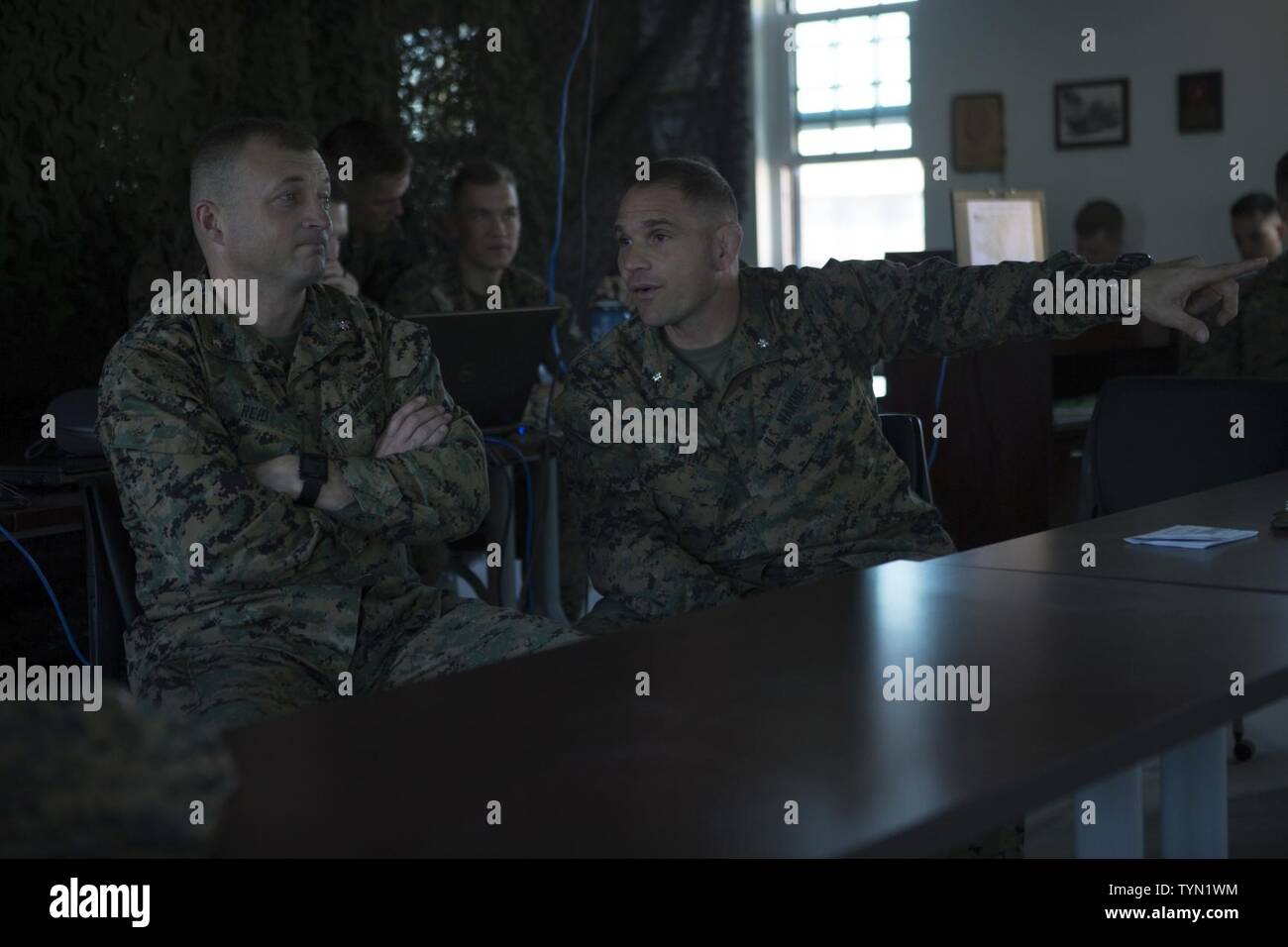 U.S. Marine Corps Lt. Col. Marcus J. Mainz, right, commanding officer ...