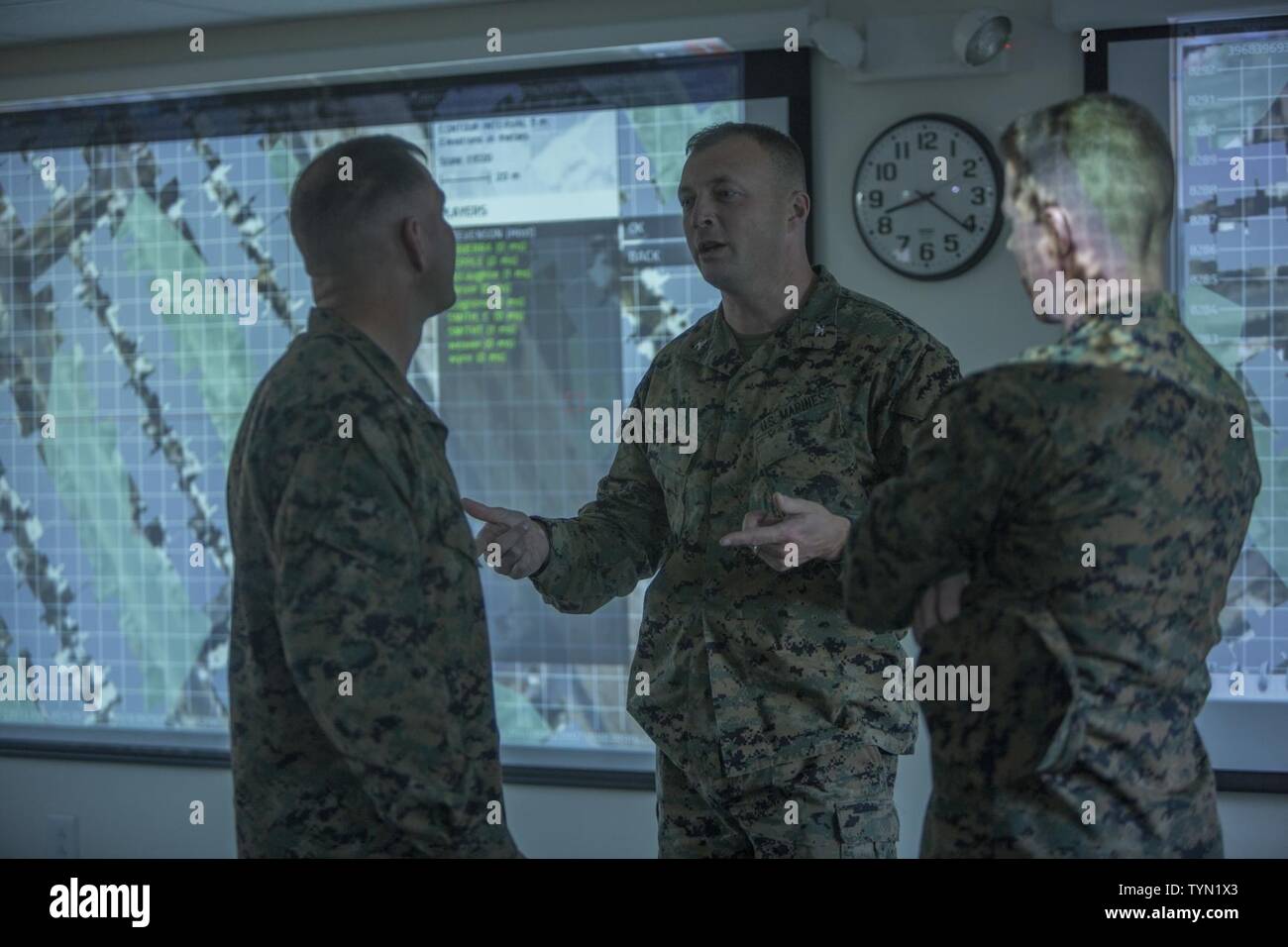 U.S. Marine Corps Lt. Col. Marcus J. Mainz, left, commanding officer ...