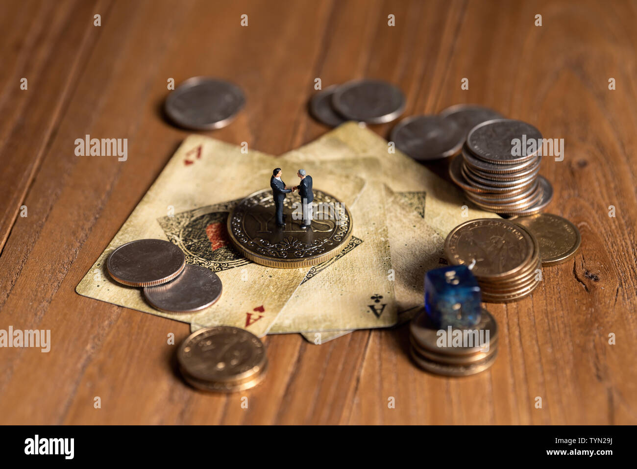 Playing cards and coins on the table Stock Photo - Alamy