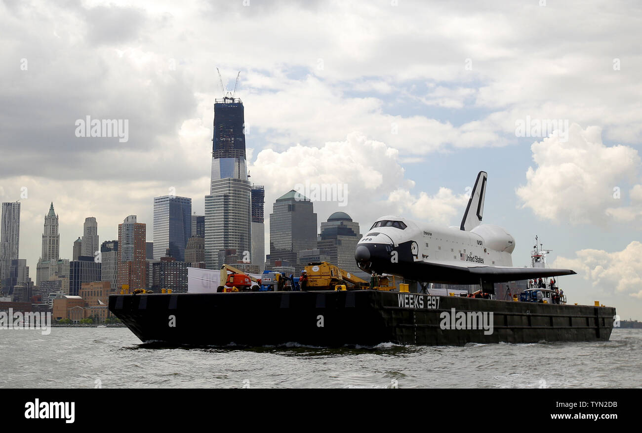 The Space Shuttle Enterprise floats on a barge on the Hudson River ...