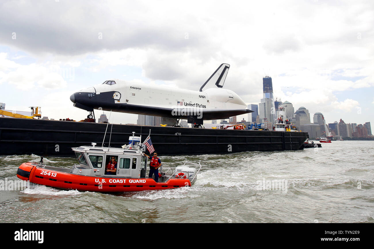 The Space Shuttle Enterprise floats on a barge on the Hudson River ...