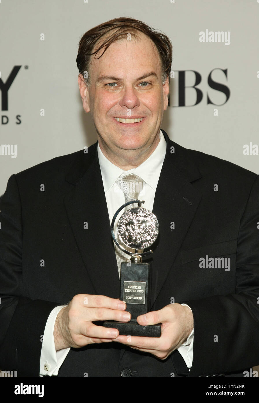Gregg Barnes poses for photographers after winning the 2012 Tony Award ...