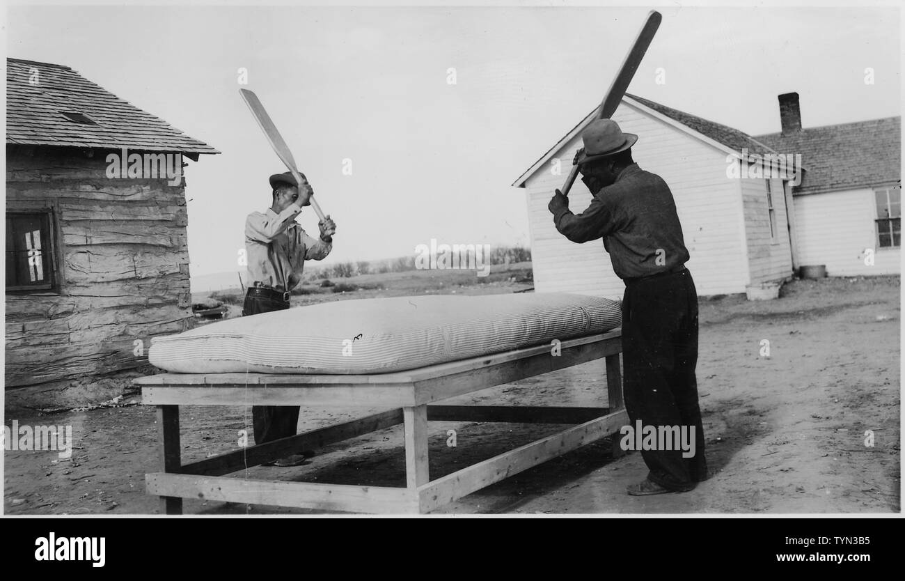 Two men beating hi-res stock photography and images - Alamy