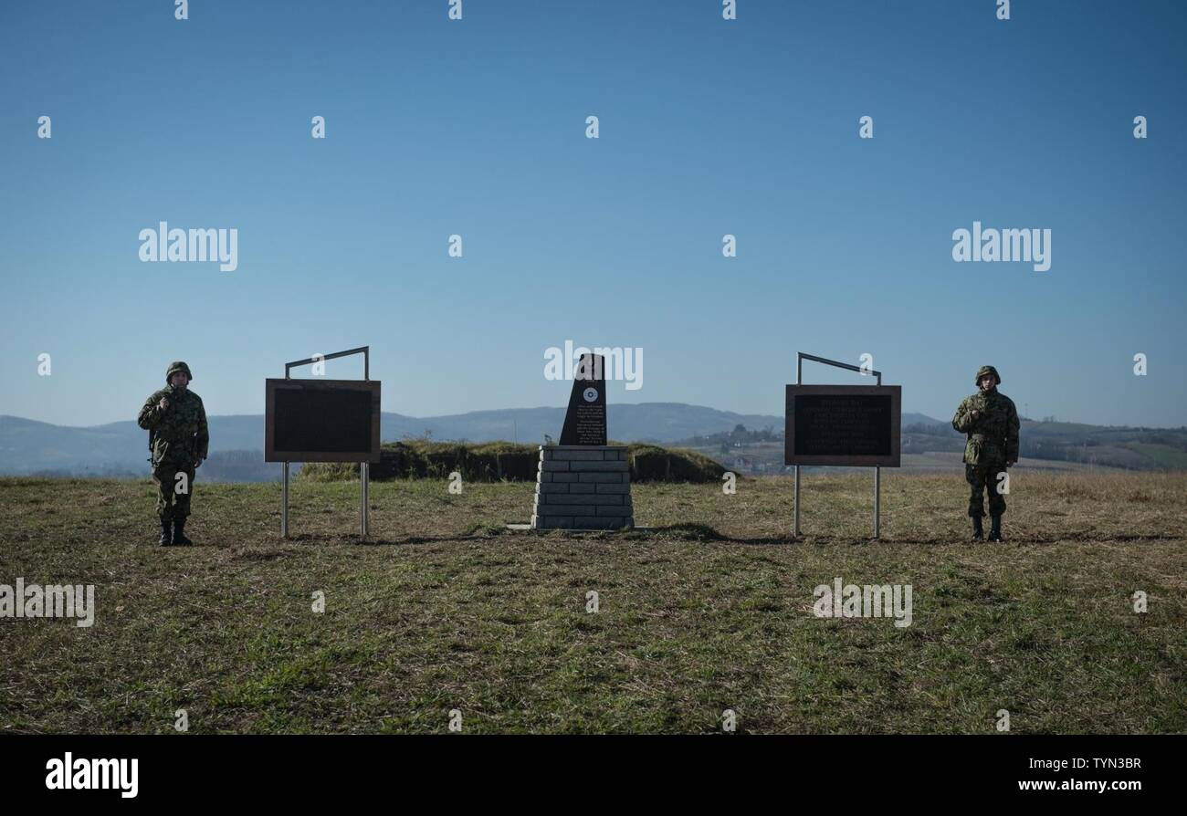 Serbian soldiers stand guard at the Operation Halyard memorial in ...