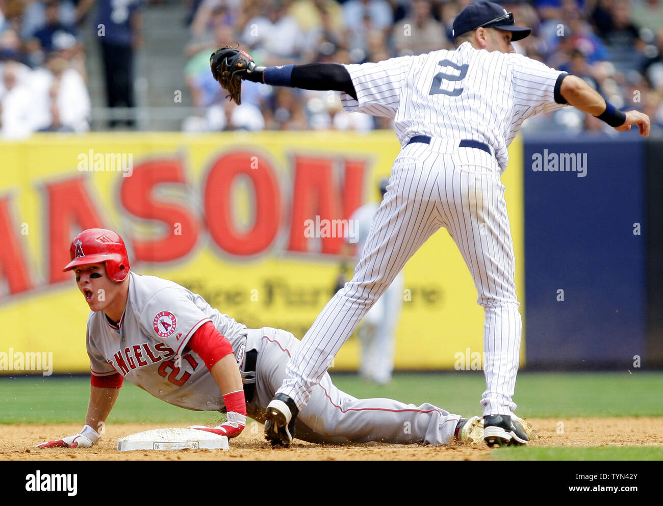 Los Angeles Angels Mike Trout slides under New York Yankees Derek Jeter ...
