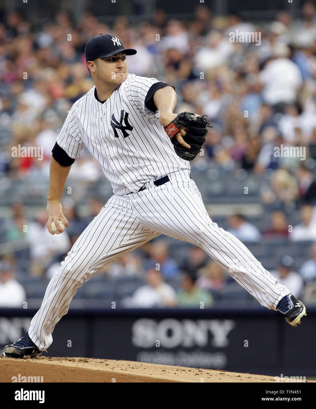 New York Yankees starting pitcher Phil Hughes throws a pitch in the ...