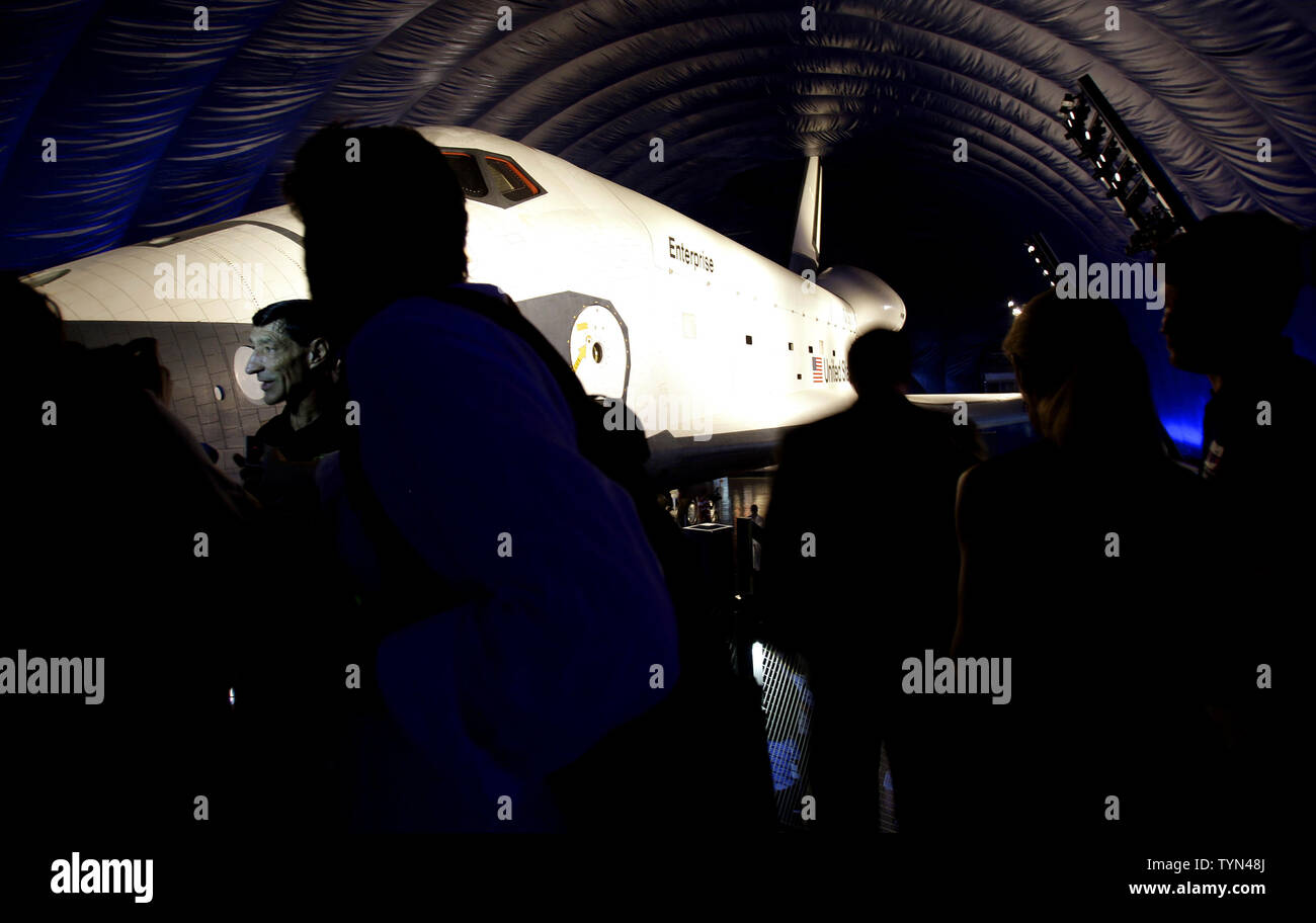 People gather around the NASA Space Shuttle Enterprise as it sits ...