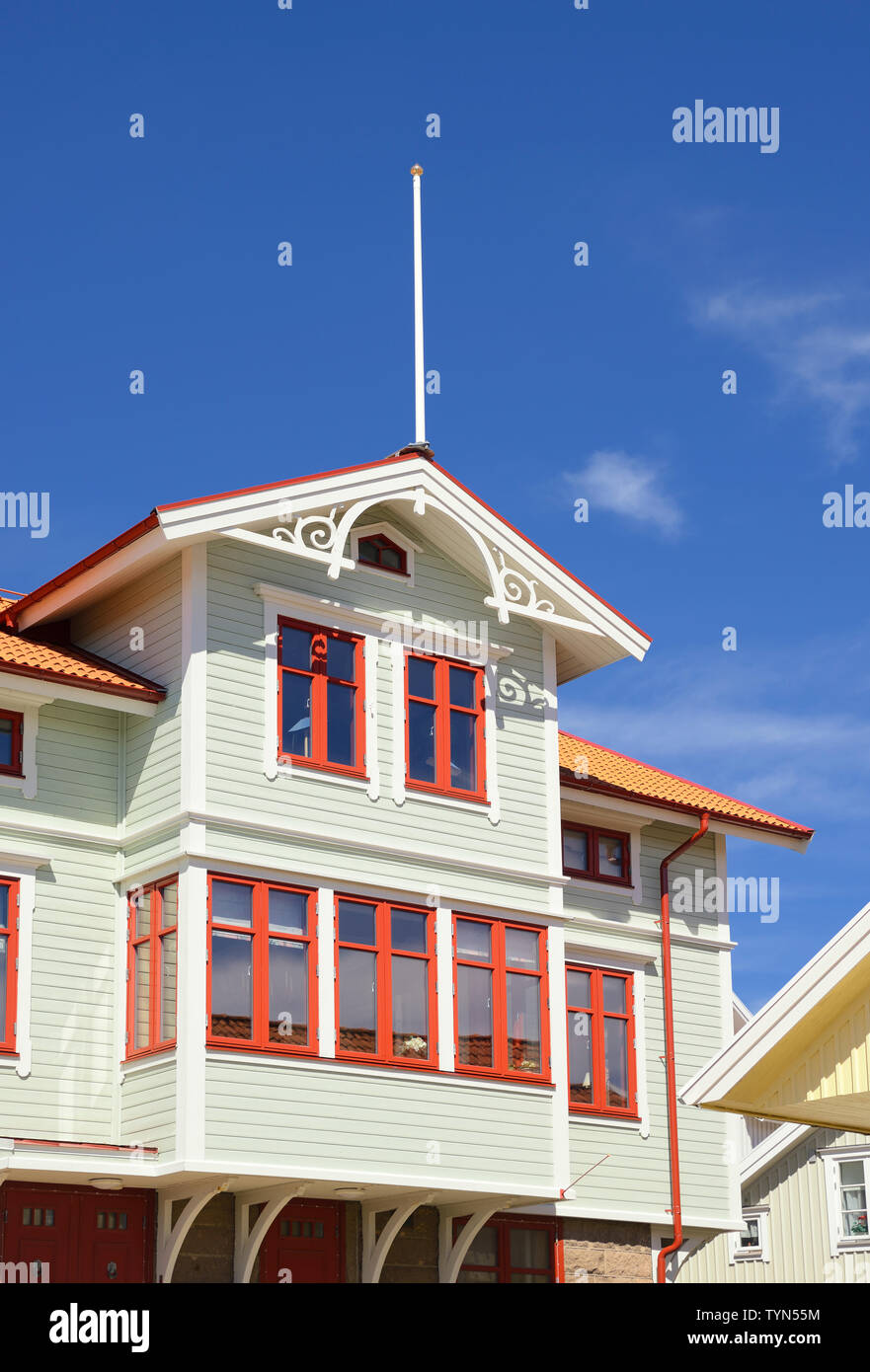 Rustic old house gable with windows Stock Photo - Alamy