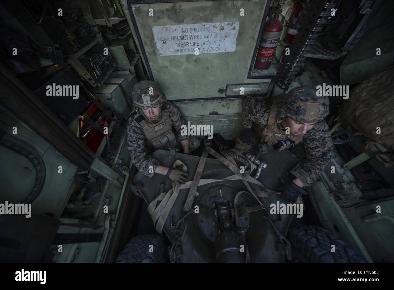 Marines with Battery B, 1st Battalion, 11th Marine Regiment, secure an ...