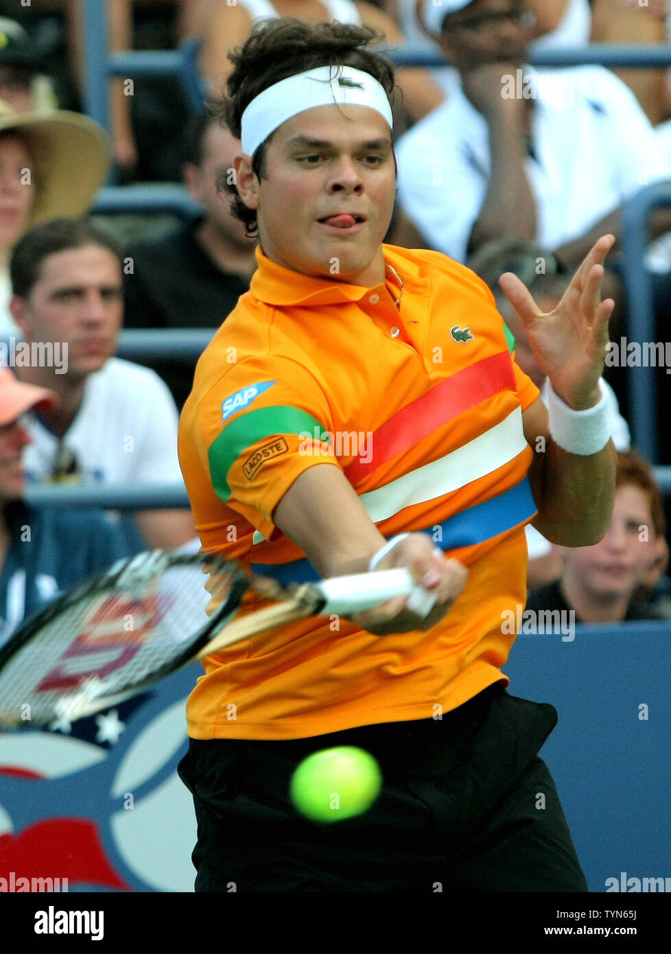 Milos Raonic, Canada, returns the ball to James Blake, USA, in the ...