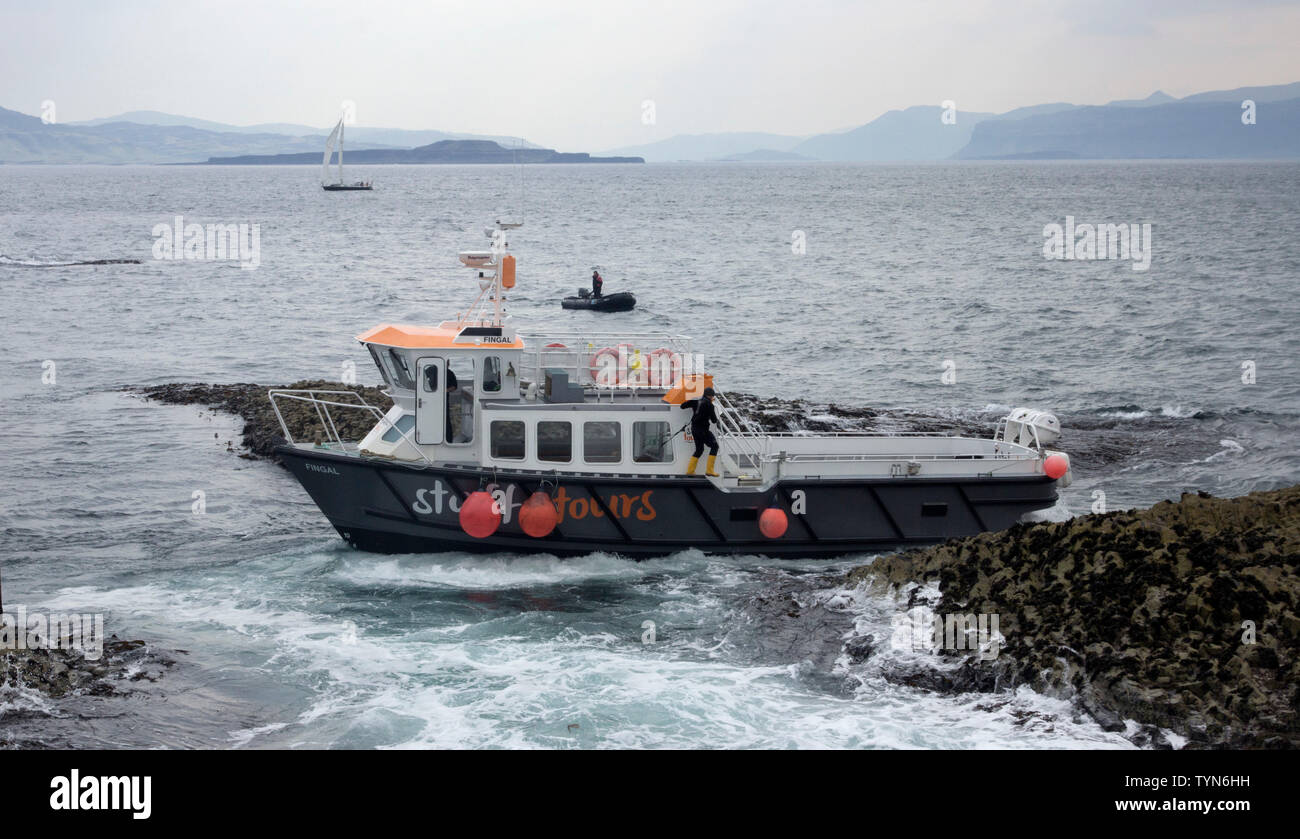 Staffa tours boat approaching landing jetty on Isle of Staffa for ...