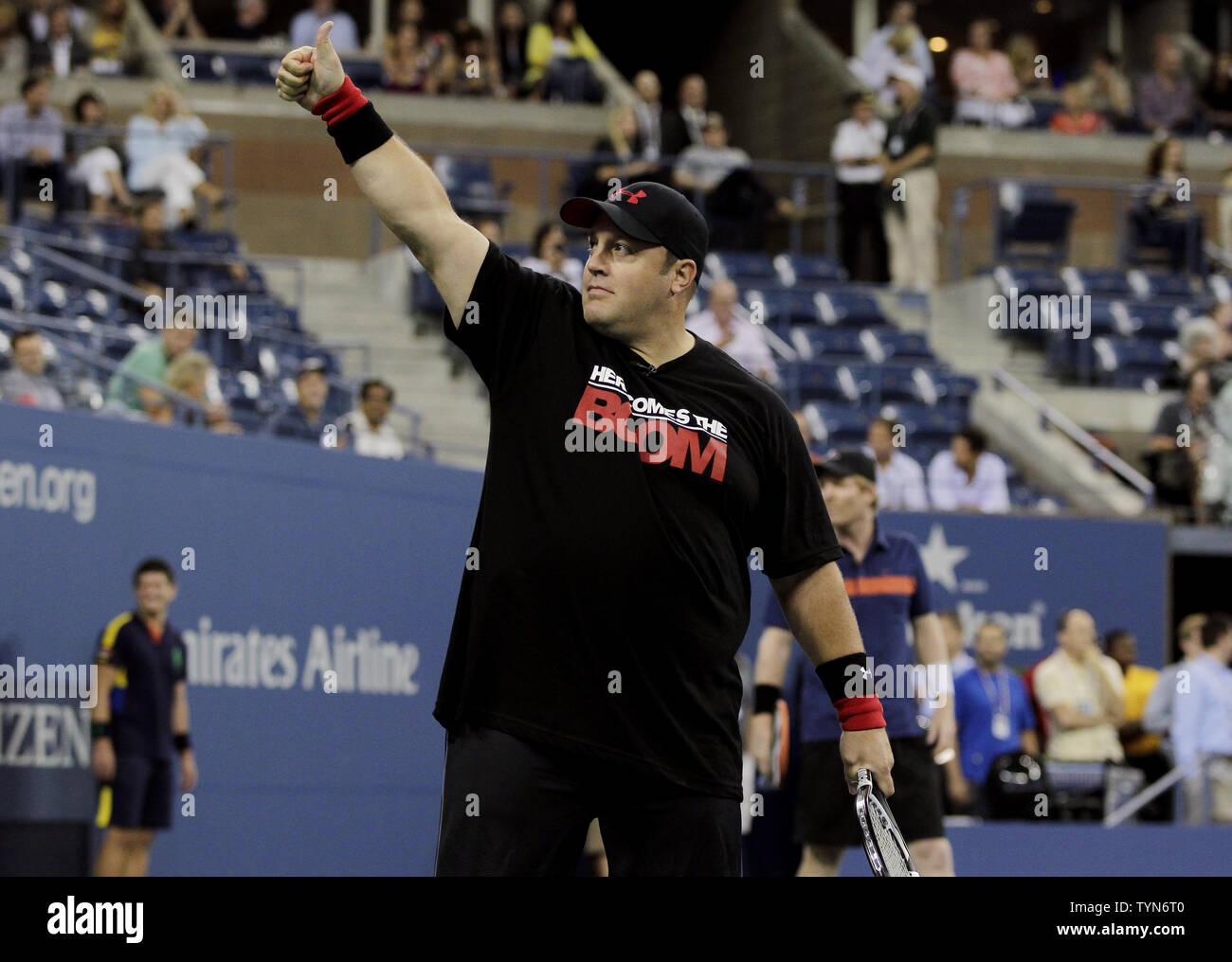 Kevin James reacts with fans while playing in a doubles exhibition ...