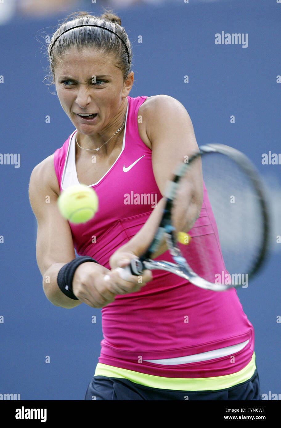Sara Errani of Italy hits a backhand in the first set of her semifinal ...