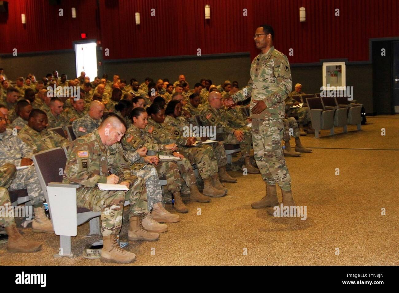 Command Sgt. Maj. James K. Sims (standing), the senior enlisted adviser ...