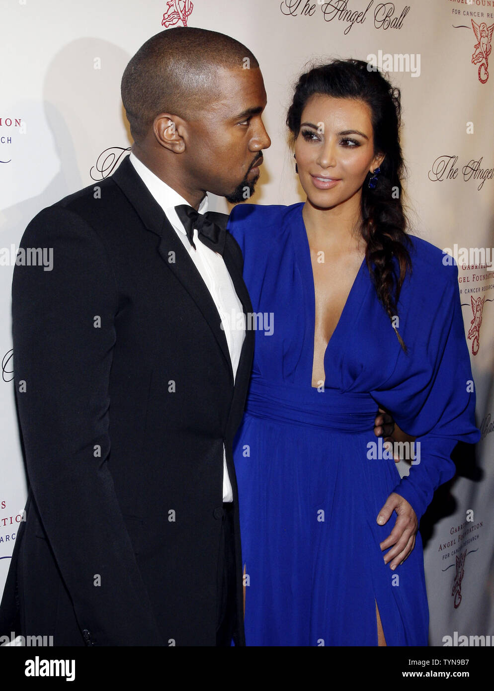 Kim Kardashian and Kanye West arrive on the red carpet at the Gabrielle ...