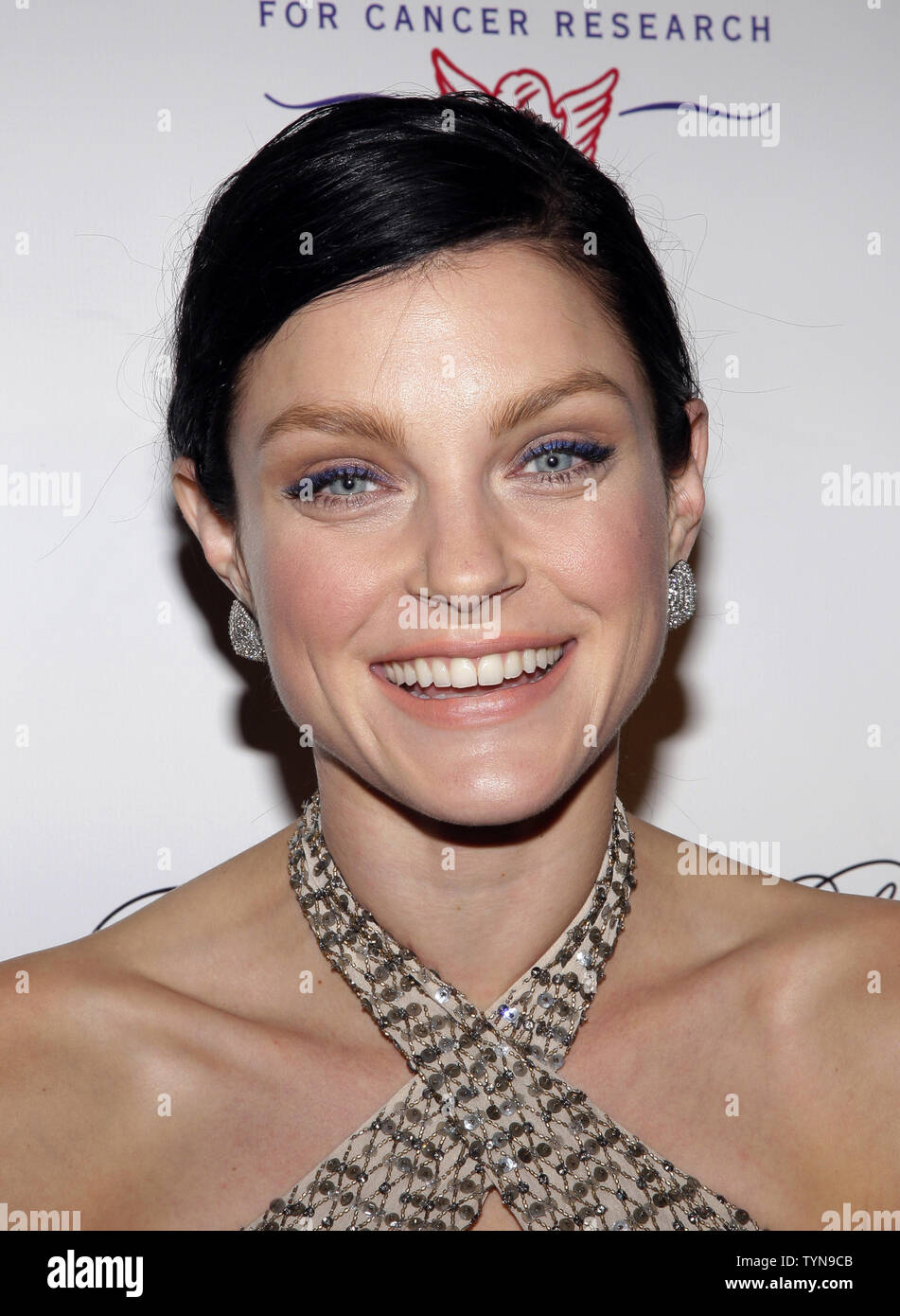 Jessica Stam arrives on the red carpet at the Gabrielle's Angel ...