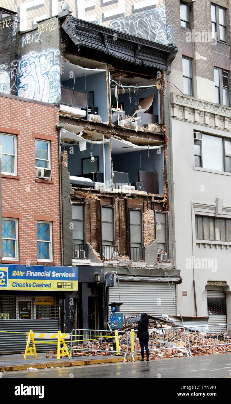 The facade of a building in Chelsea peeled off after being battered by ...