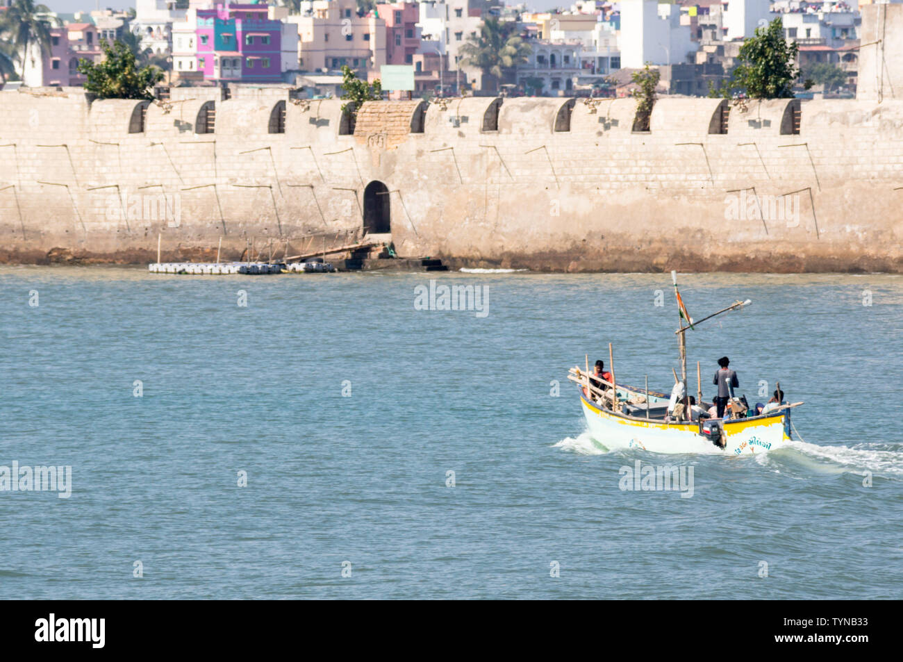 Diu, Daman, Gujarat, India - Circa 2019: boat approaching the stone ...