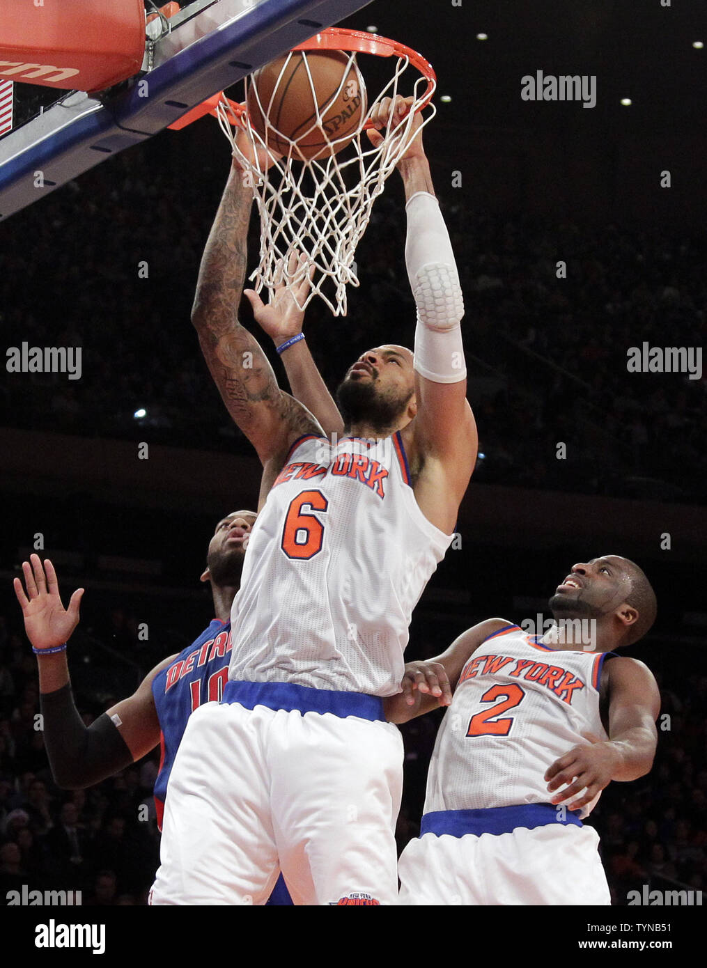 New York Knicks Raymond Felton watches Tyson Chandler dunk the ...