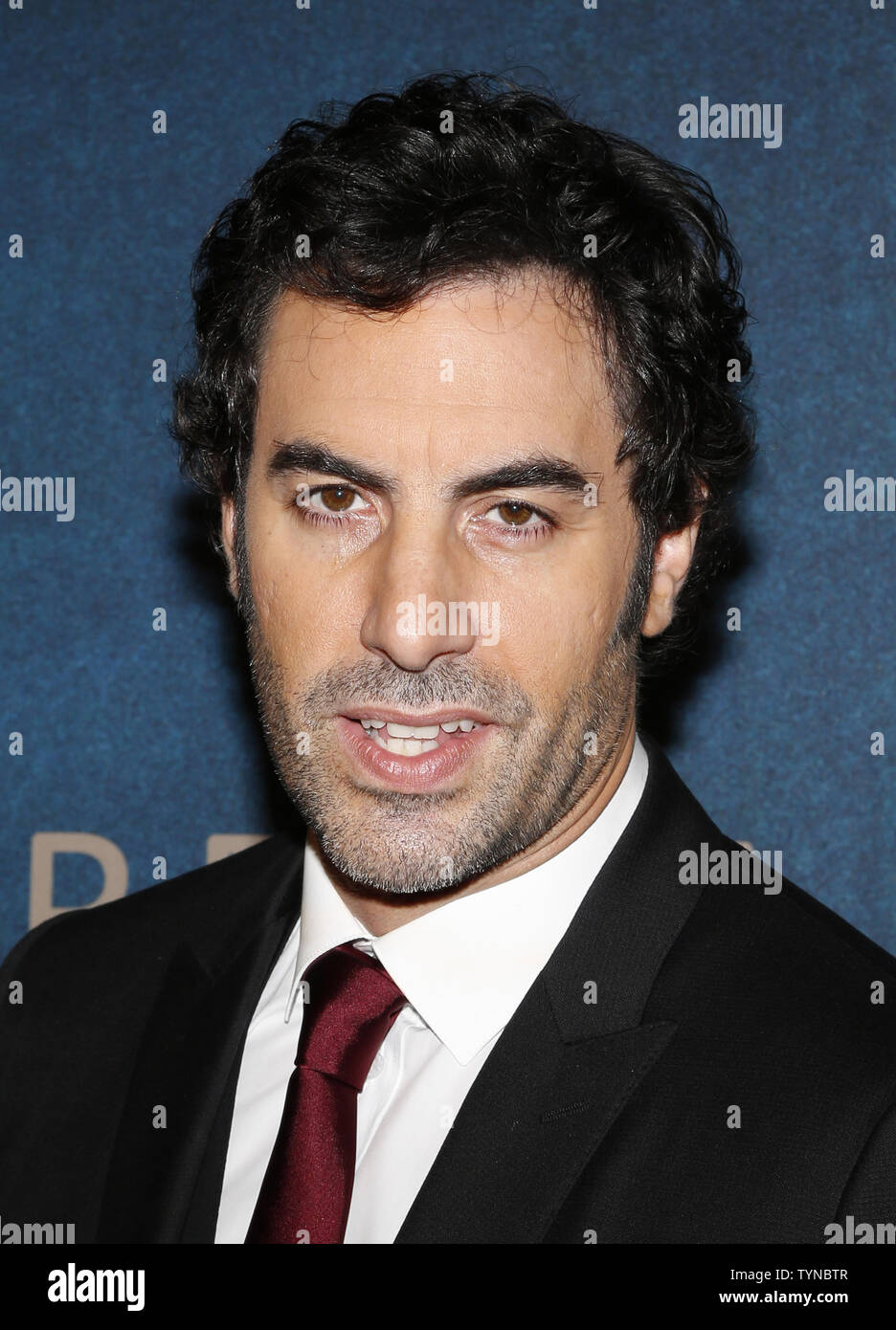 Sacha Baron Cohen arrives on the red carpet at the 'Les Miserables ...