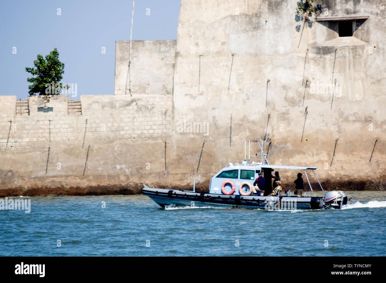 Diu, Daman, Gujarat, India - Circa 2019: boat approaching the stone ...