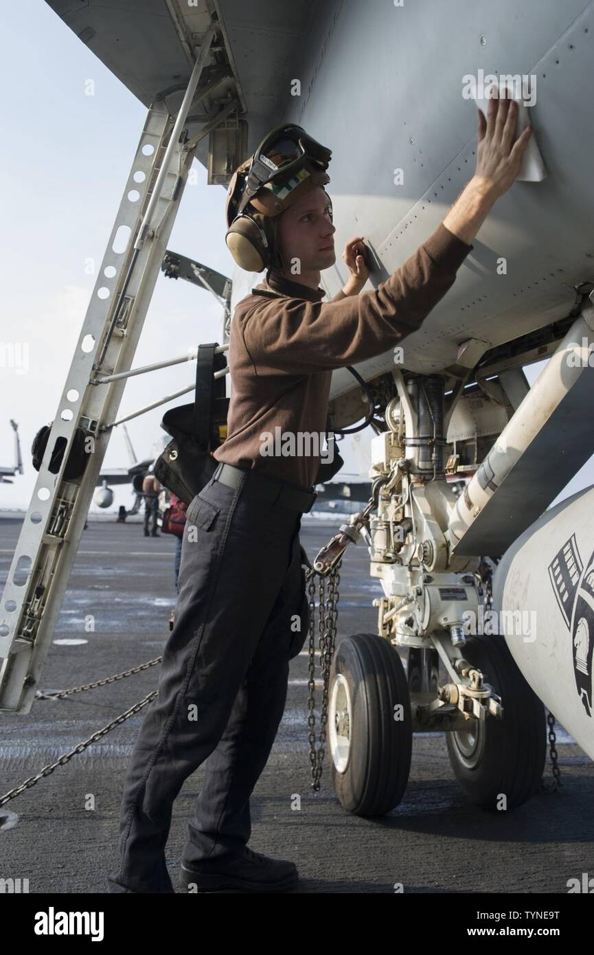 GULF (Nov. 18, 2016) Seaman Travis Reichert, from Layton, Utah, wipes ...