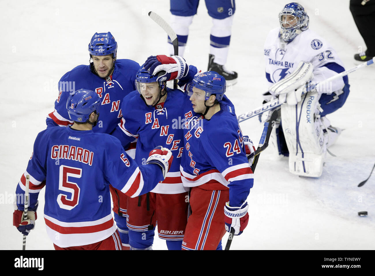 Tampa Bay Lightning Mathieu Garon watches New York Rangers Taylor Pyatt ...
