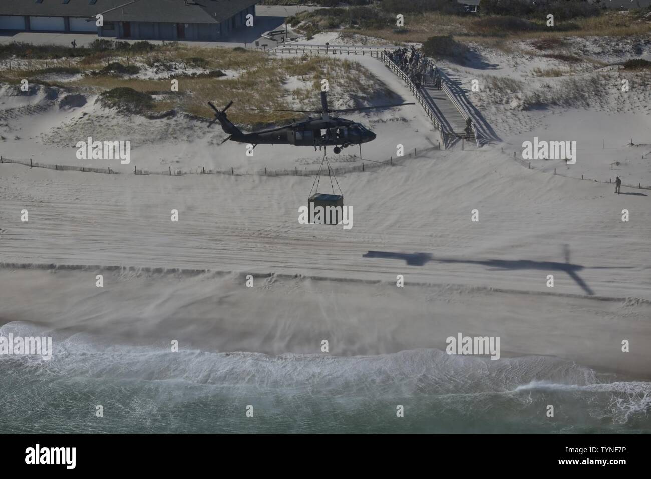 A New Jersey Army National Guard Black Hawk helicopter sling loads New ...