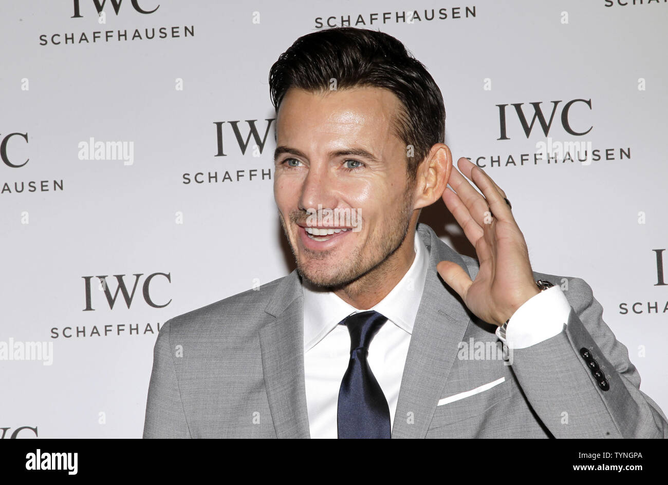 Alex Lundqvis arrives on the red carpet at the IWC/Tribeca Film ...