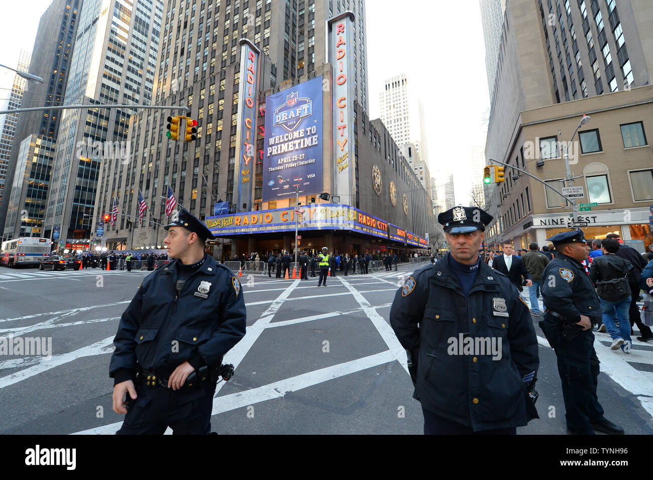 NYPD police officers stand guard before the start of the 2012 NFL Draft ...