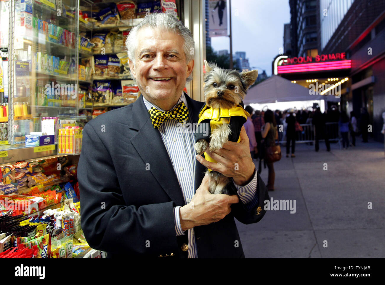 Schmitty The Weather Dog is held by Meteorlogist Ron Trotta outside at ...