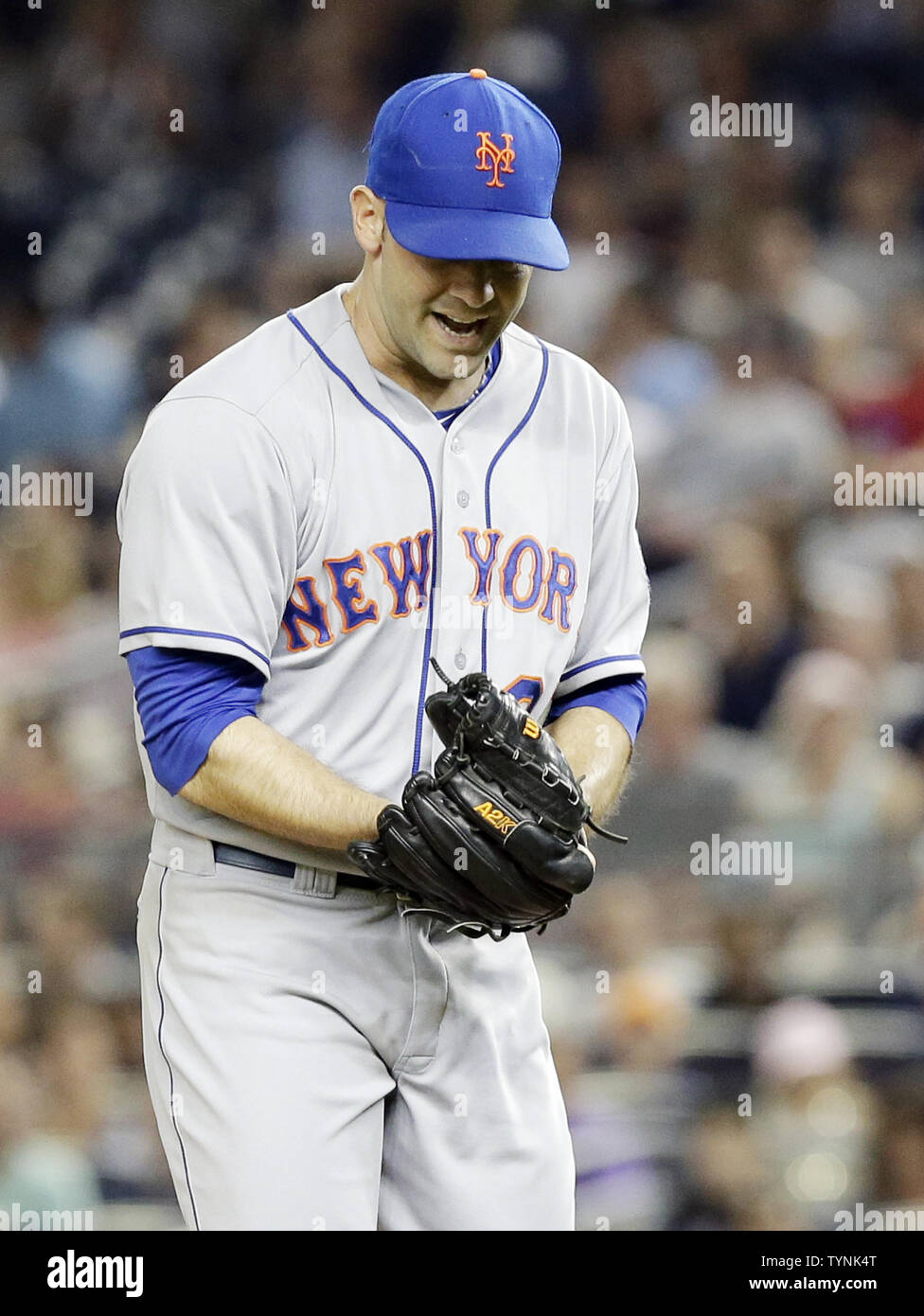 New York Mets starting pitcher Dillon Gee reacts after striking out the ...
