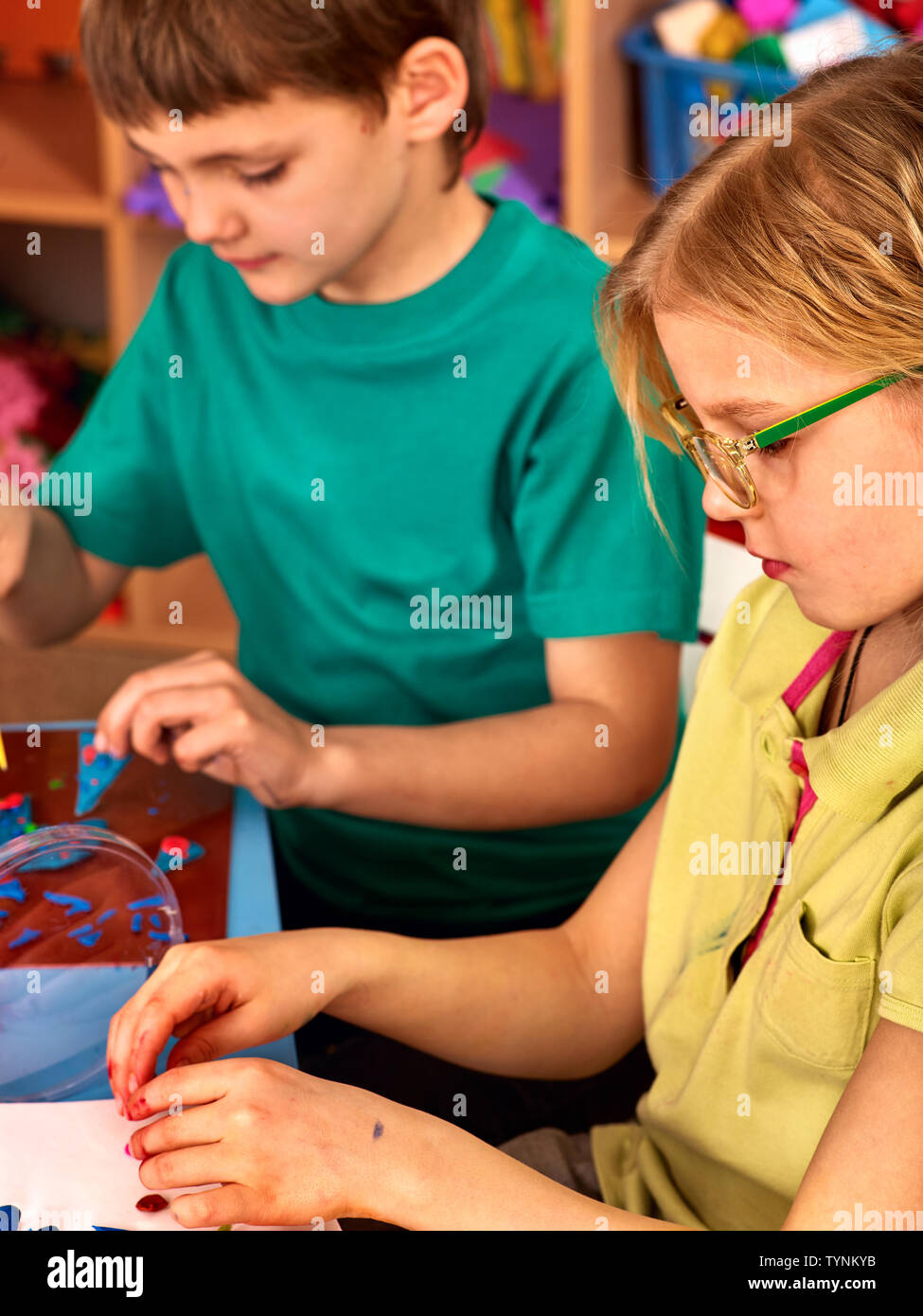 Children model from plasticine in school craft lesson Stock Photo - Alamy