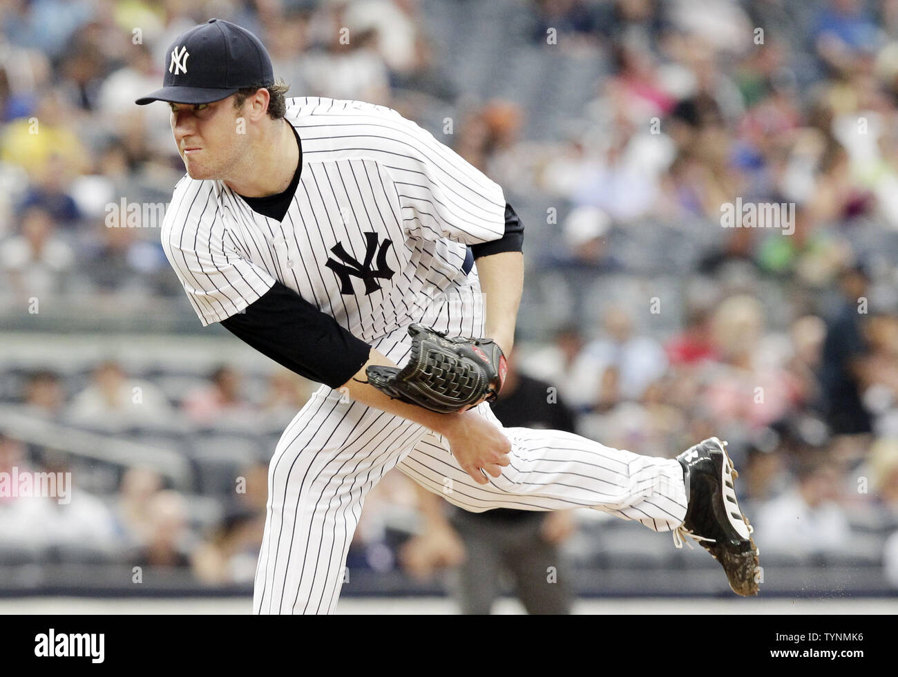 New York Yankees starting pitcher Phil Hughes throws a pitch in the ...