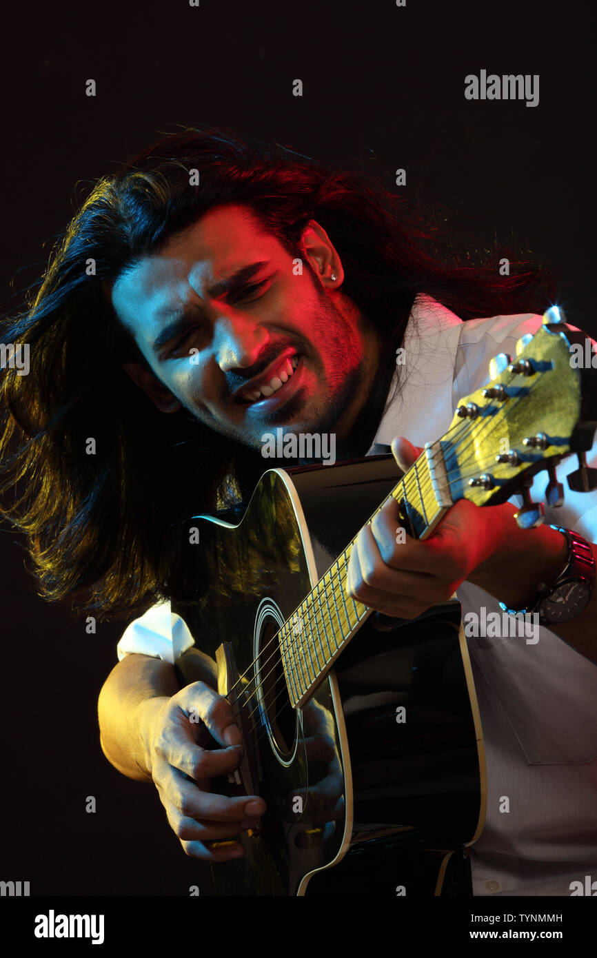Indian man playing long hi-res stock photography and images - Alamy
