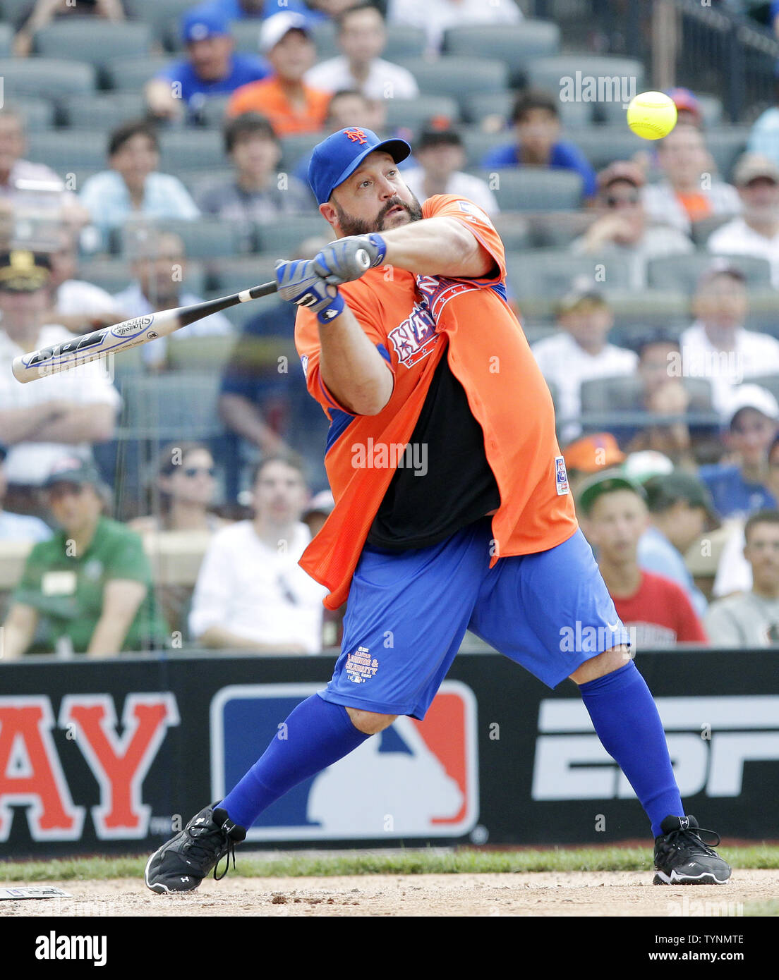 Kevin James takes a swing at a ball at the All-Star Legends & Celebrity ...